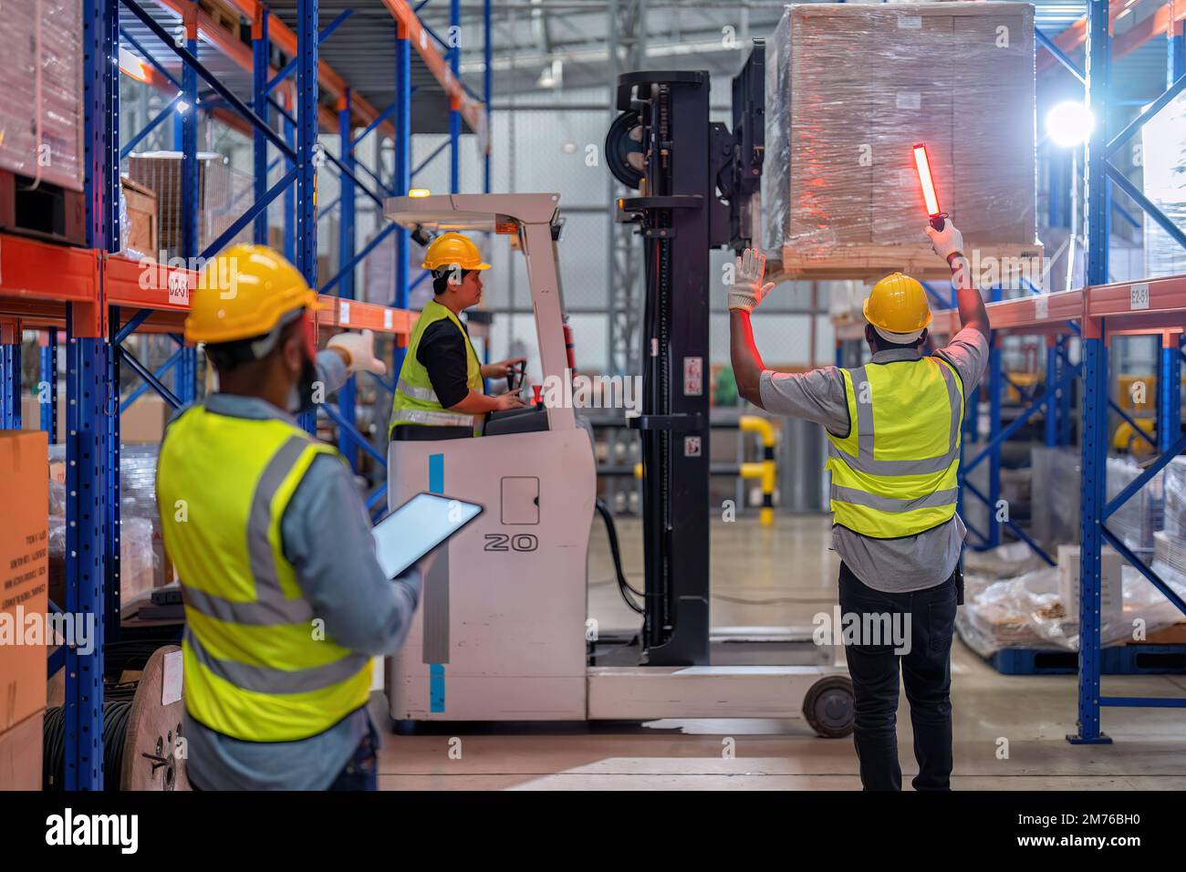 African american working in warehouse hold red light give signal to ...