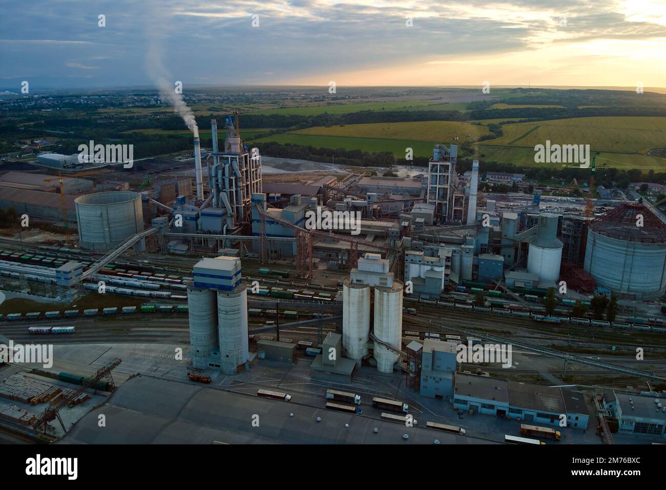 Aerial view of cement factory tower with high concrete plant structure ...