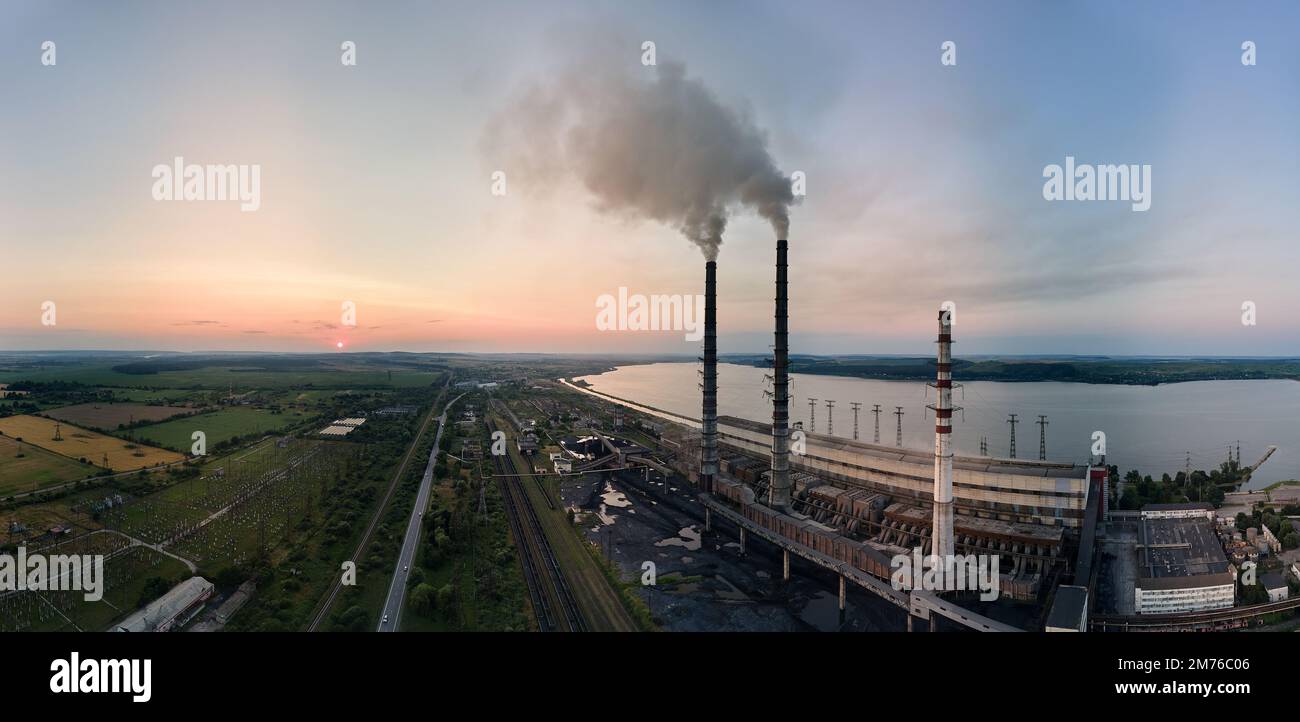 Aerial view of coal power plant high pipes with black smokestack ...