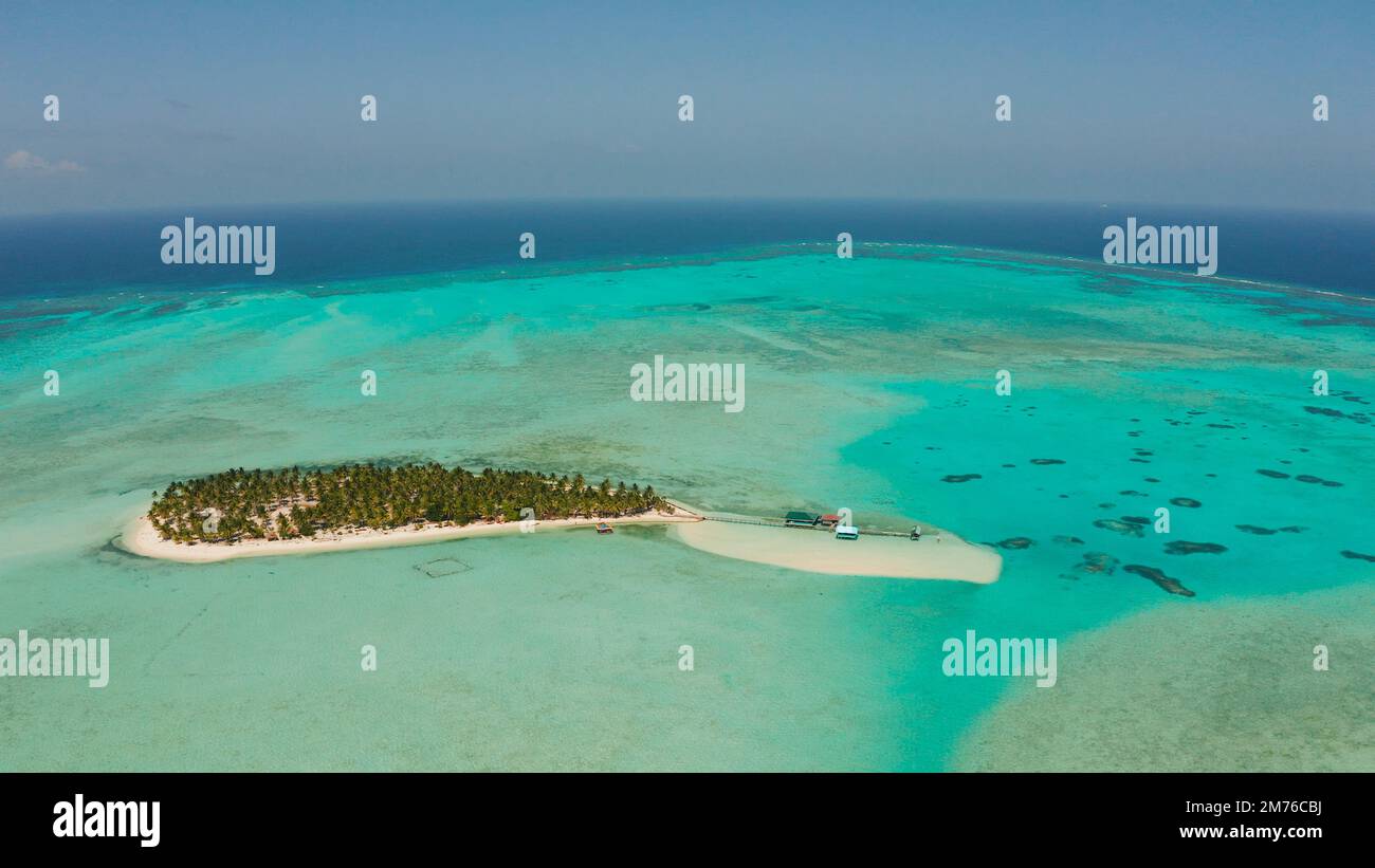 Tropical island with beautiful beach, palm trees and turquoise water ...