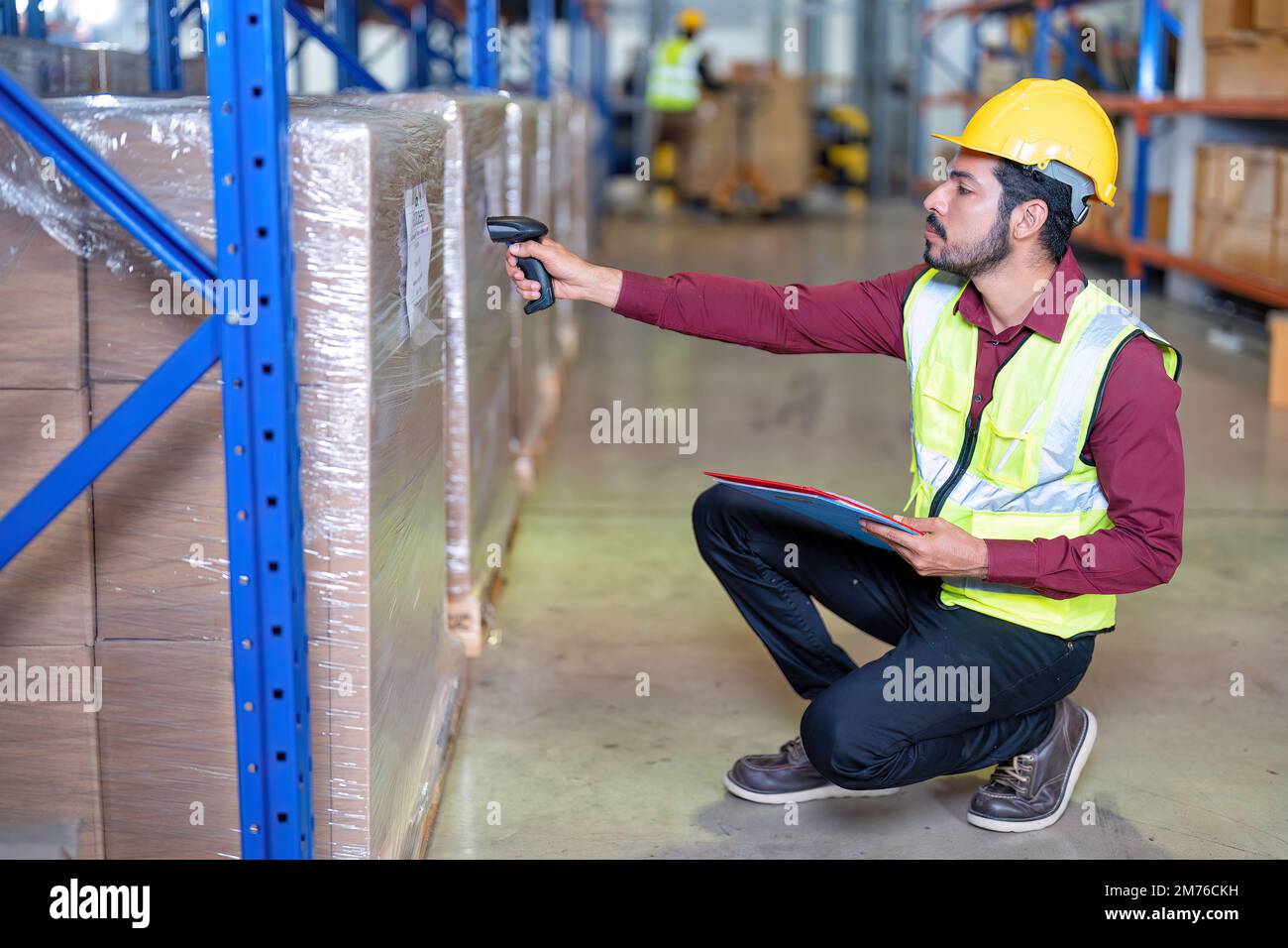 ware house worker stock check and barcode scan the goods on wooden ...