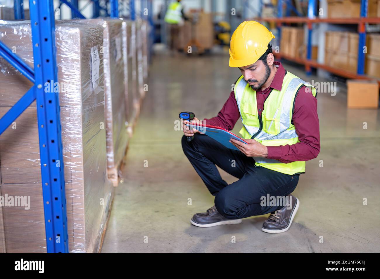 ware house worker stock check and barcode scan the goods on wooden ...