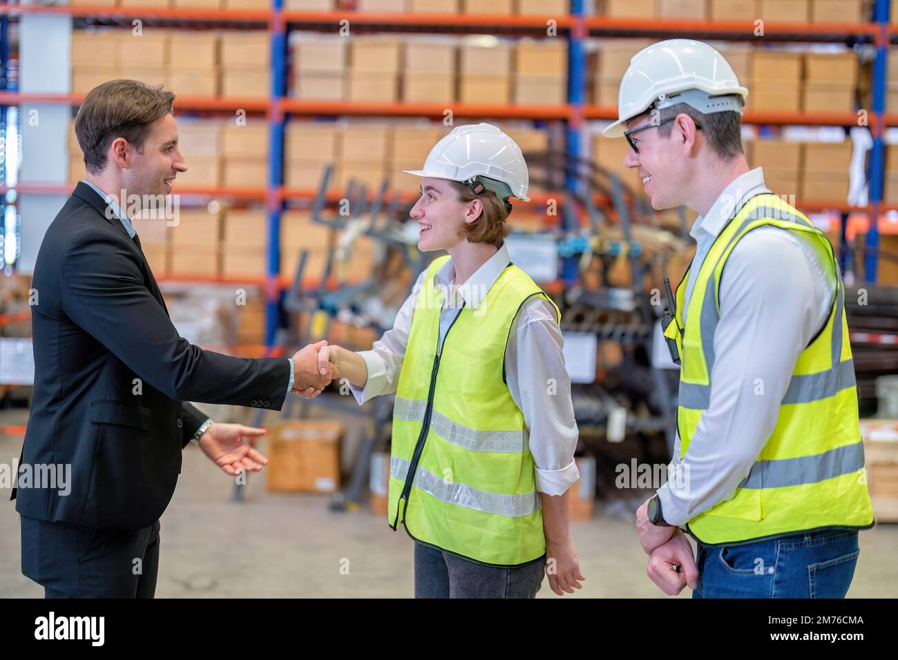 manager visit staff in storage warehouse and have some discussion with ...