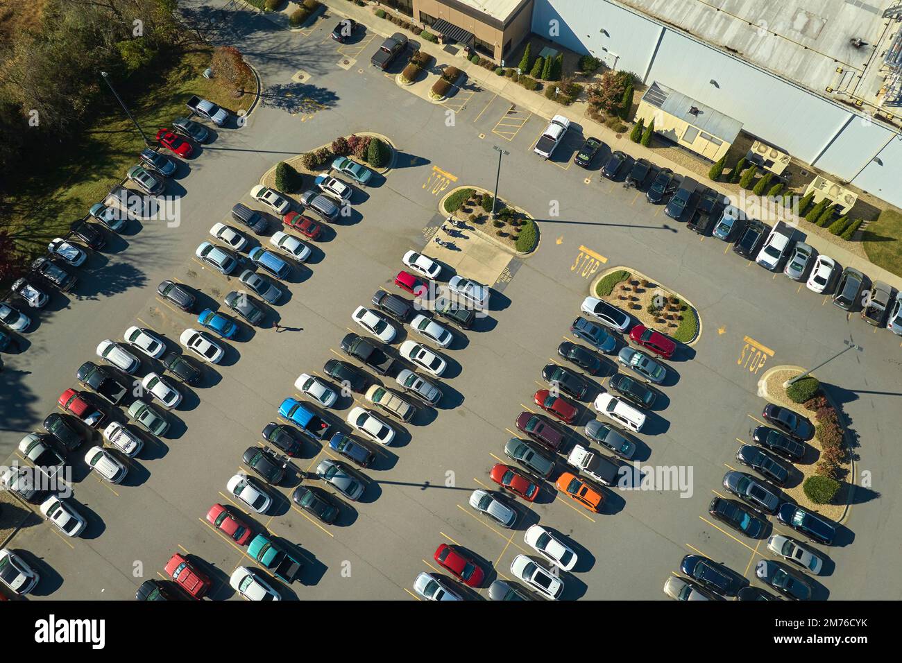 Aerial view of large parking lot in front of rgocery store with many ...