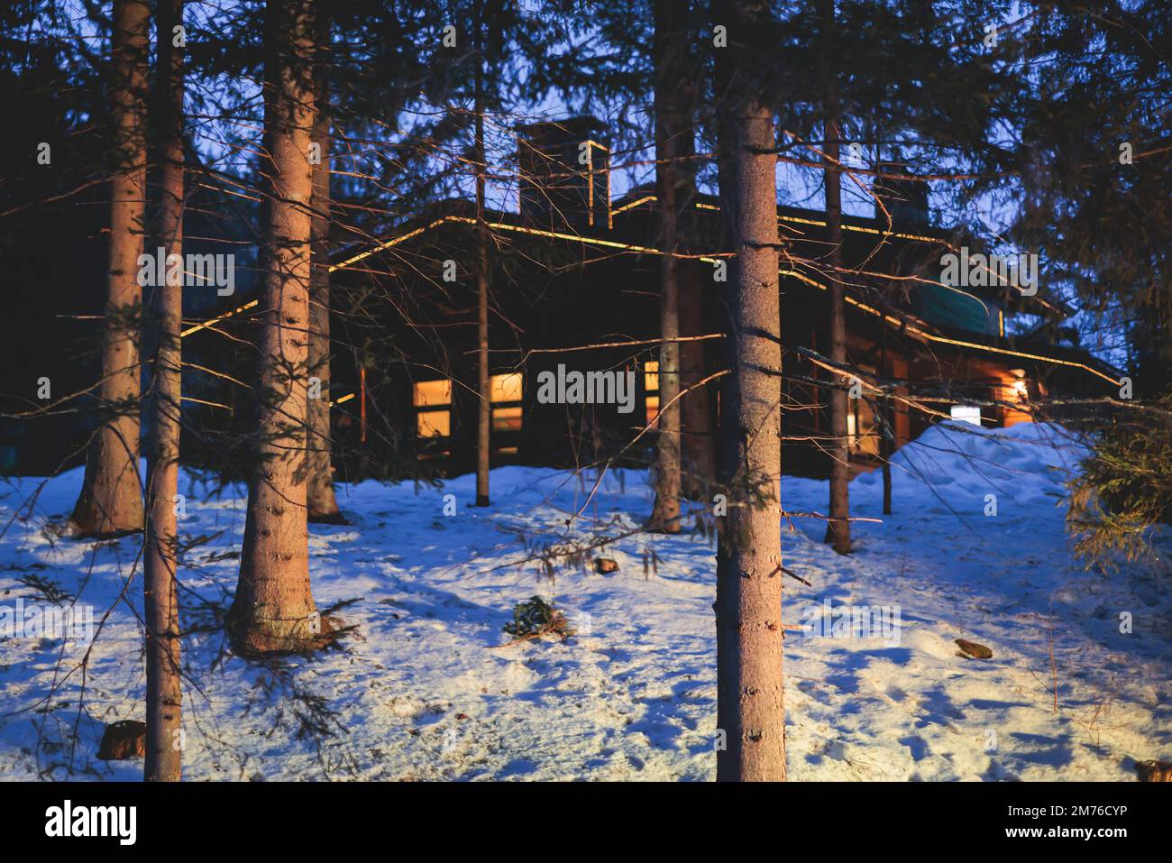 View of a cozy wooden scandinavian cabin cottage chalet house covered ...