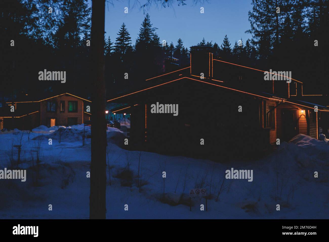 View of a cozy wooden scandinavian cabin cottage chalet house covered ...