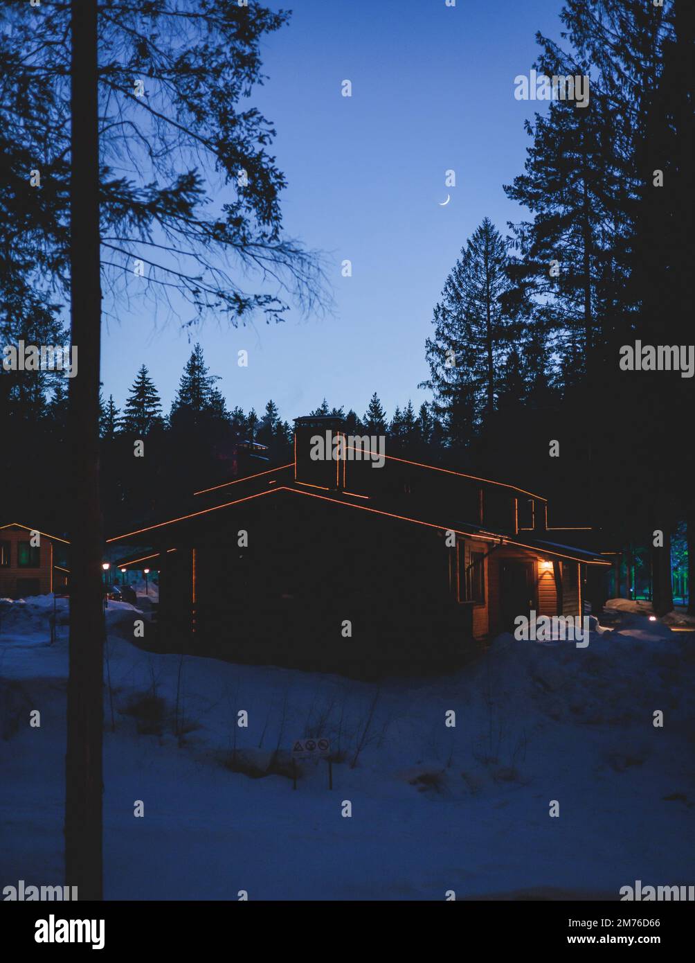 View of a cozy wooden scandinavian cabin cottage chalet house covered ...