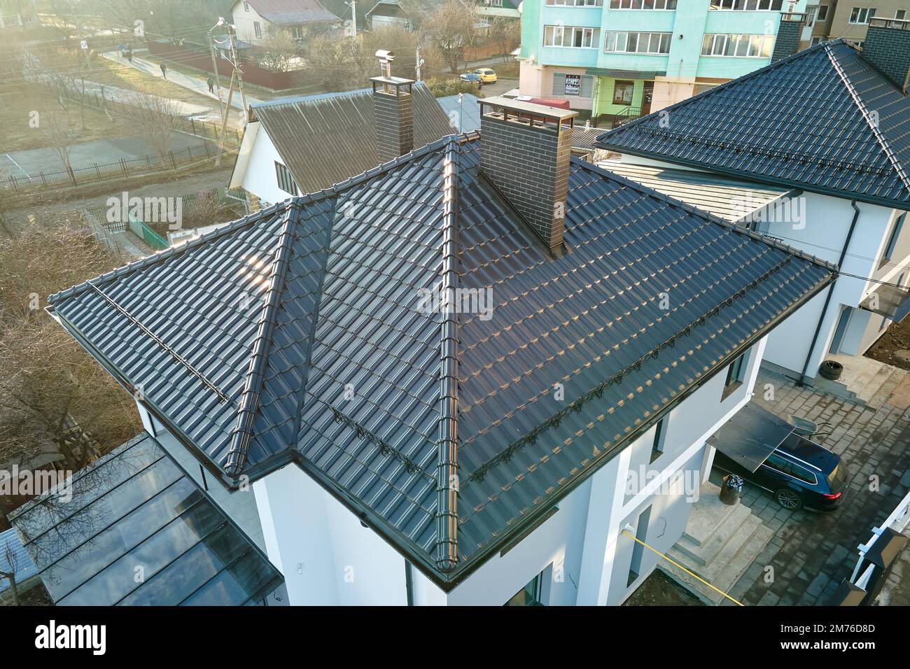 Aerial view of private house with ceramic shingles covered roof top ...