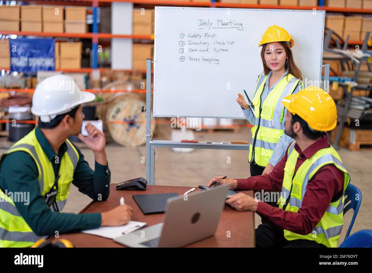 Group of worker in the warehouse factory conduct toolbox talk daily meeting focus on safety ...