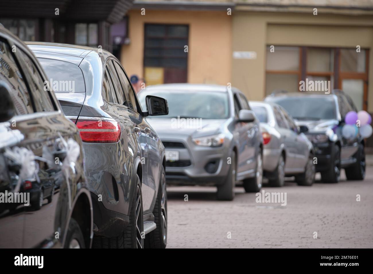Cars parked in line on city street side. Urban traffic concept Stock ...
