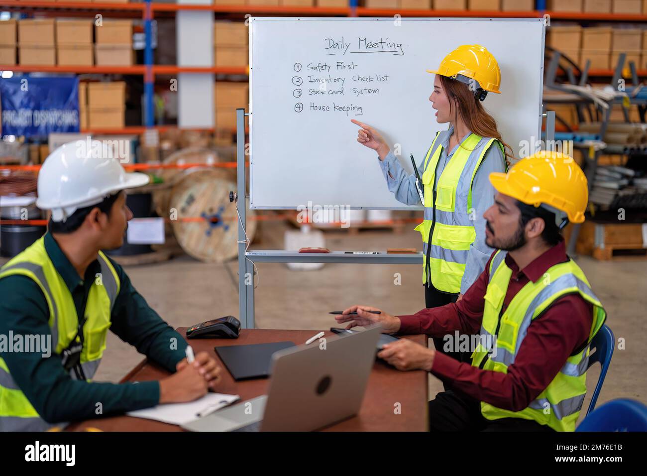 Group of worker in the warehouse factory conduct toolbox talk daily ...
