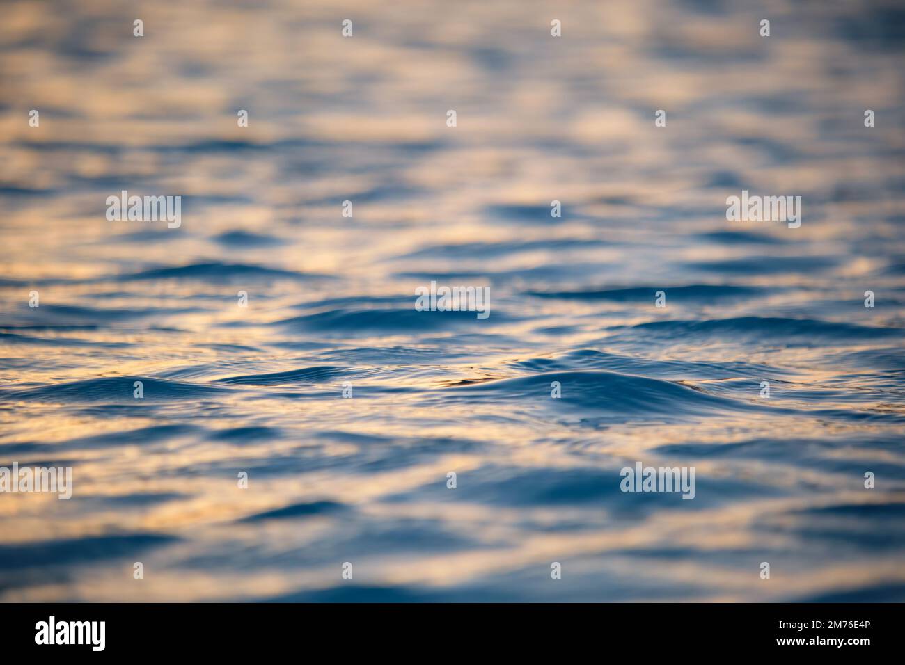 Closeup seascape surface of blue sea water with small ripple waves ...