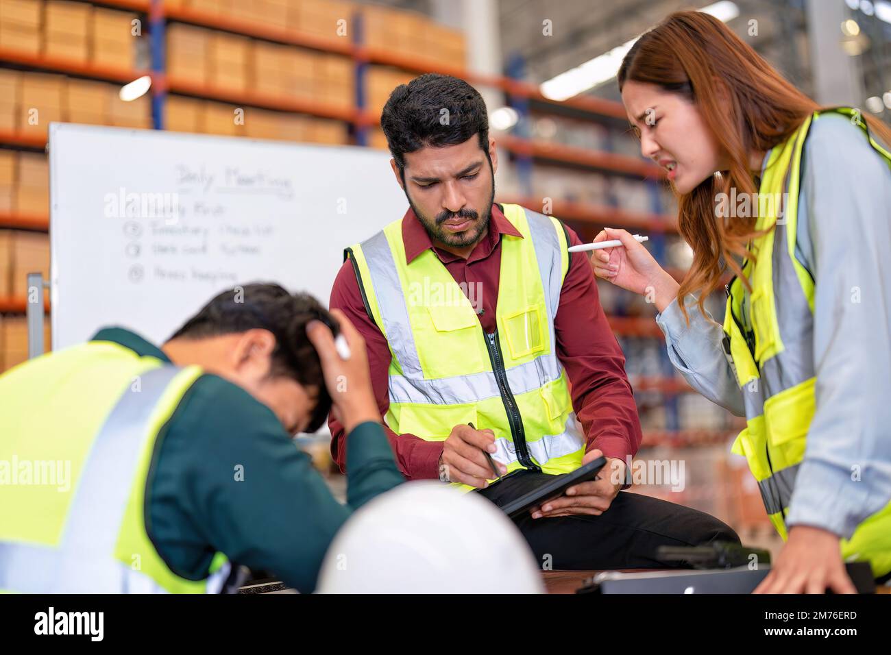 Group of worker in the warehouse factory conduct toolbox talk daily ...