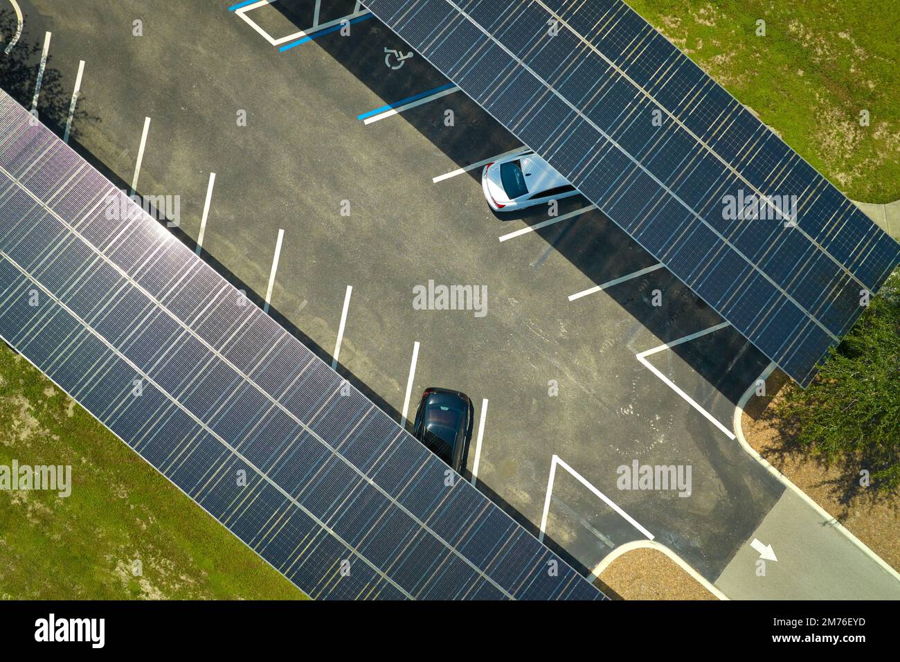 Solar panels installed over parking lot for parked cars for effective ...