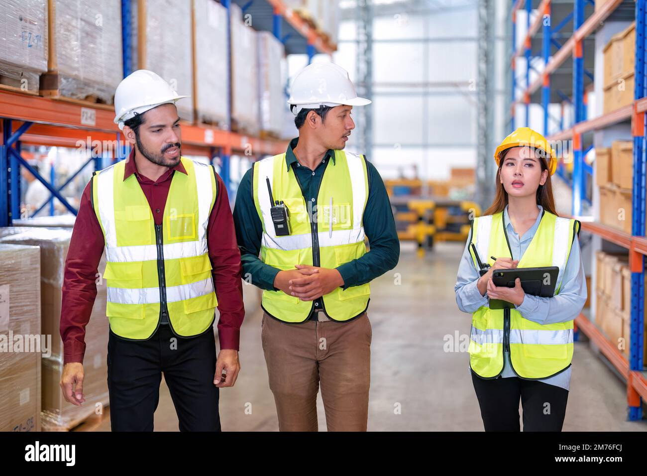 Worker in warehouse hold tablet check list perform inventory stock ...