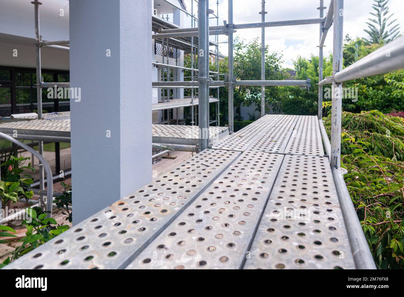 Modern house construction with scaffold pole platform. New build ...