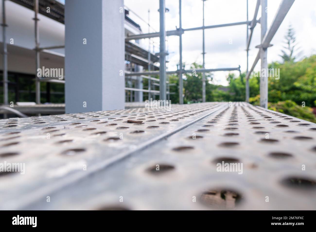 Modern house construction with scaffold pole platform. New build ...