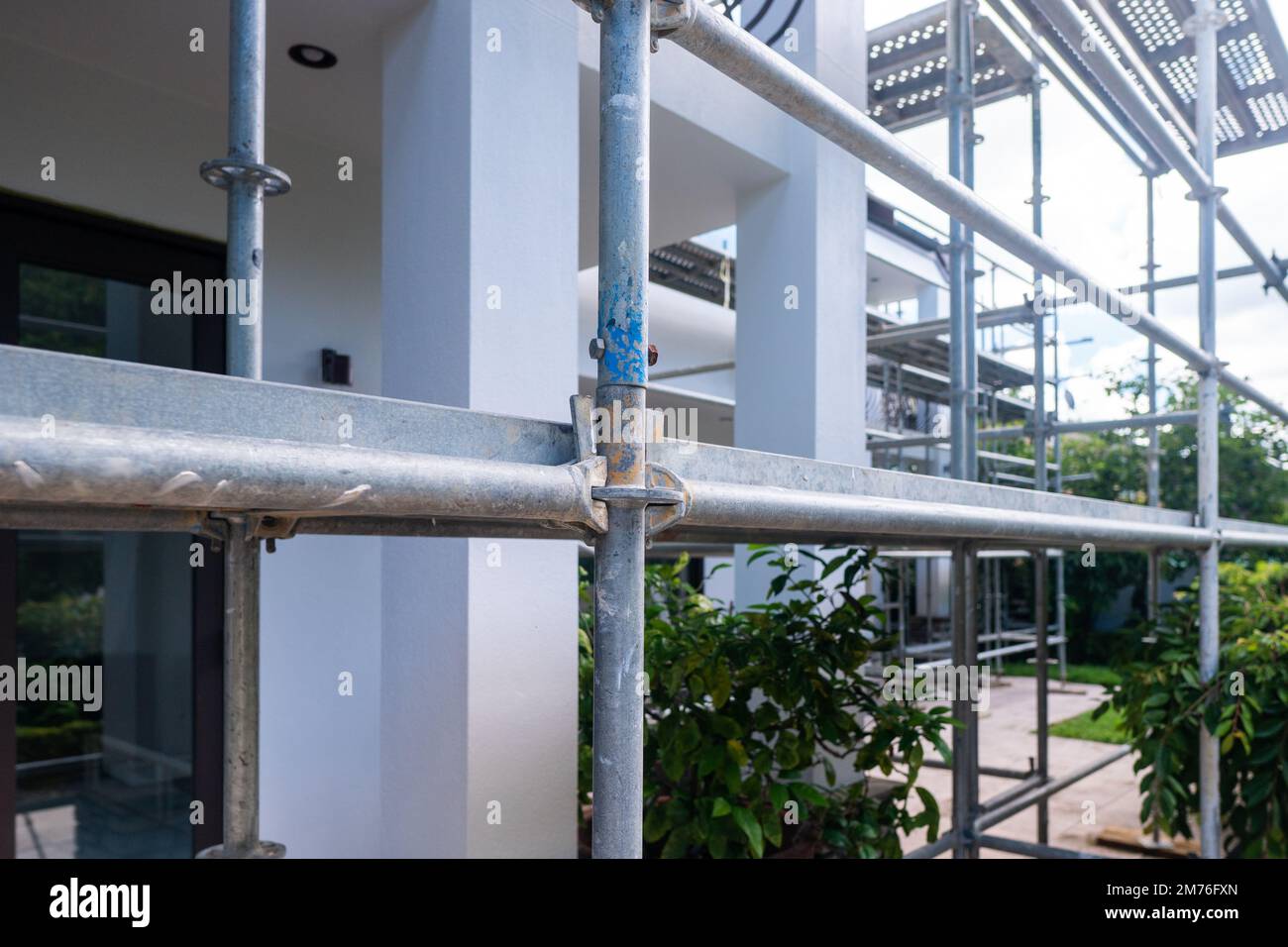 Modern house construction with scaffold pole platform. New build ...