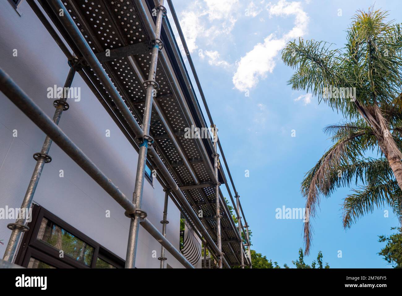 Modern house construction with scaffold pole platform. New build ...