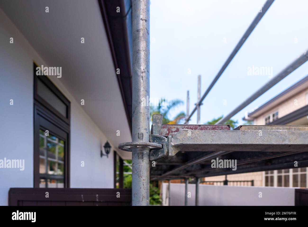 Modern house construction with scaffold pole platform. New build ...