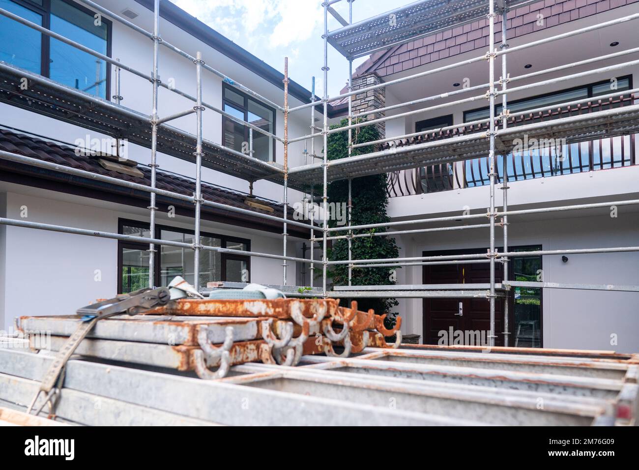 Modern house construction with scaffold pole platform. New build ...