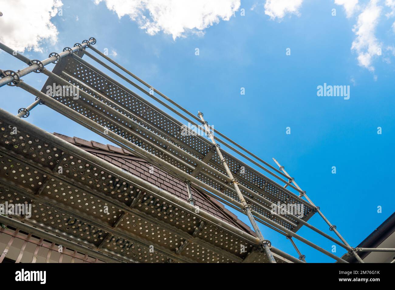 Modern house construction with scaffold pole platform. New build ...