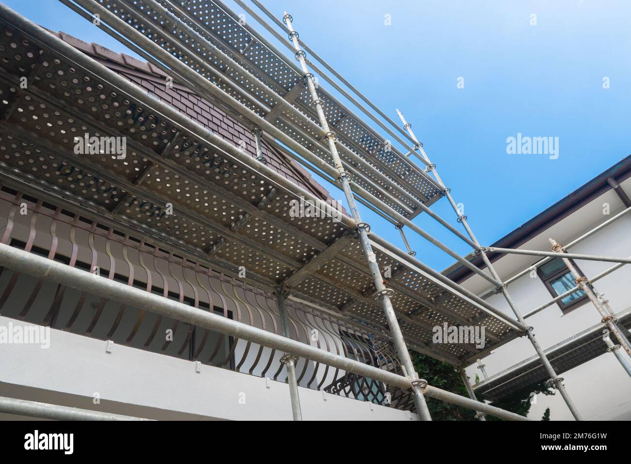 Modern house construction with scaffold pole platform. New build ...