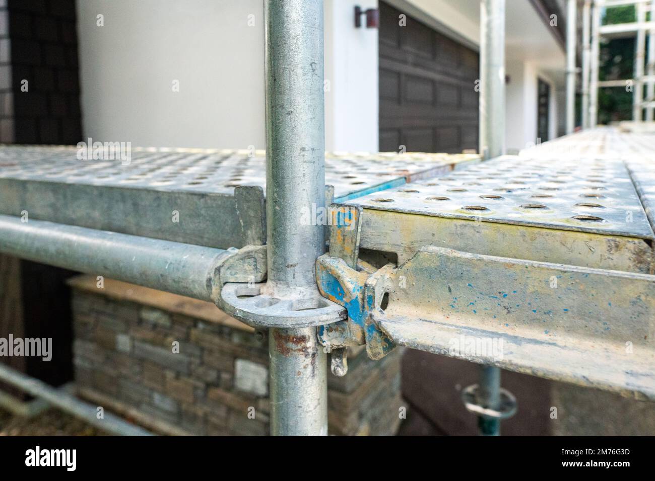 Modern house construction with scaffold pole platform. New build ...