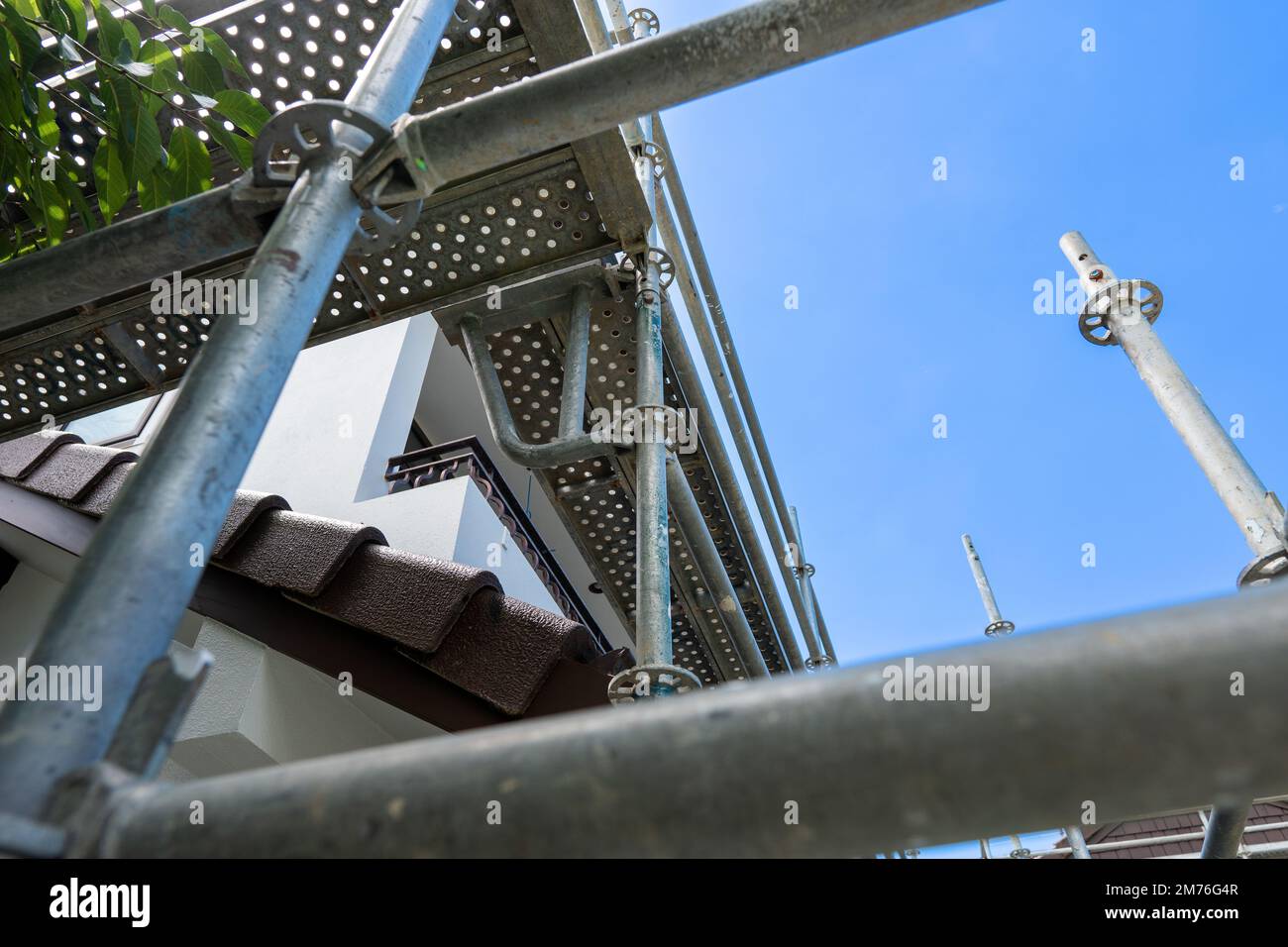 Modern house construction with scaffold pole platform. New build ...