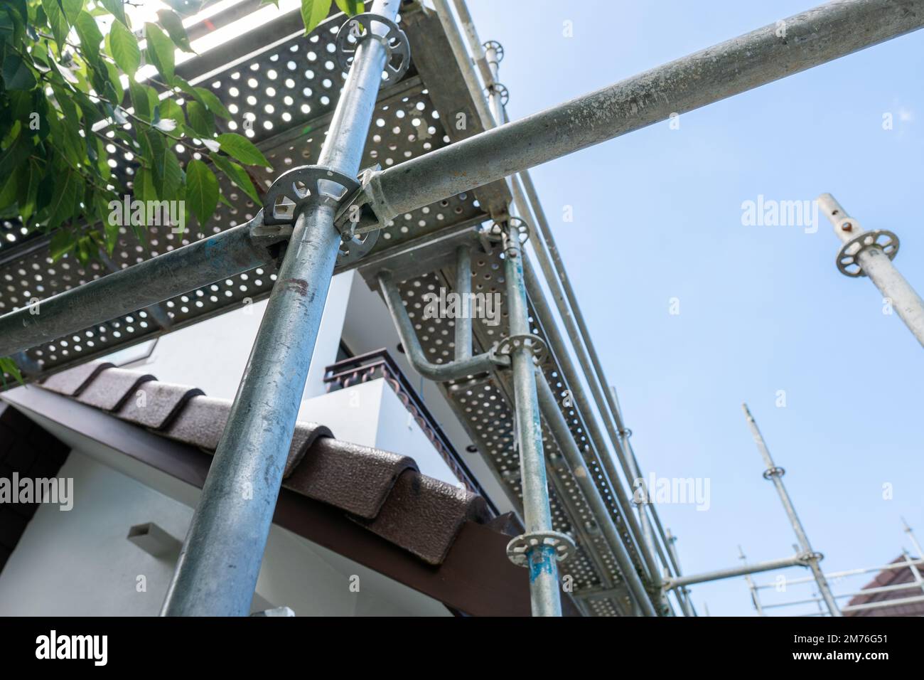 Modern house construction with scaffold pole platform. New build ...