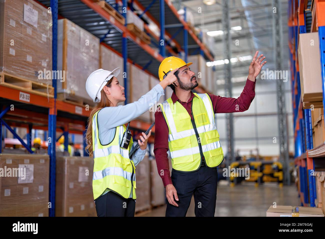 Worker in warehouse hold tablet check list perform inventory stock ...