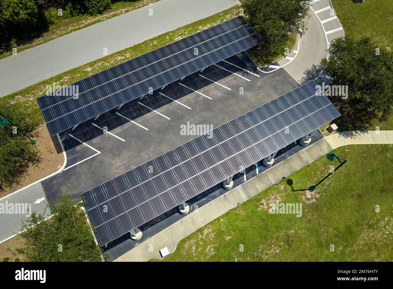Solar panels installed over parking lot for parked cars for effective ...