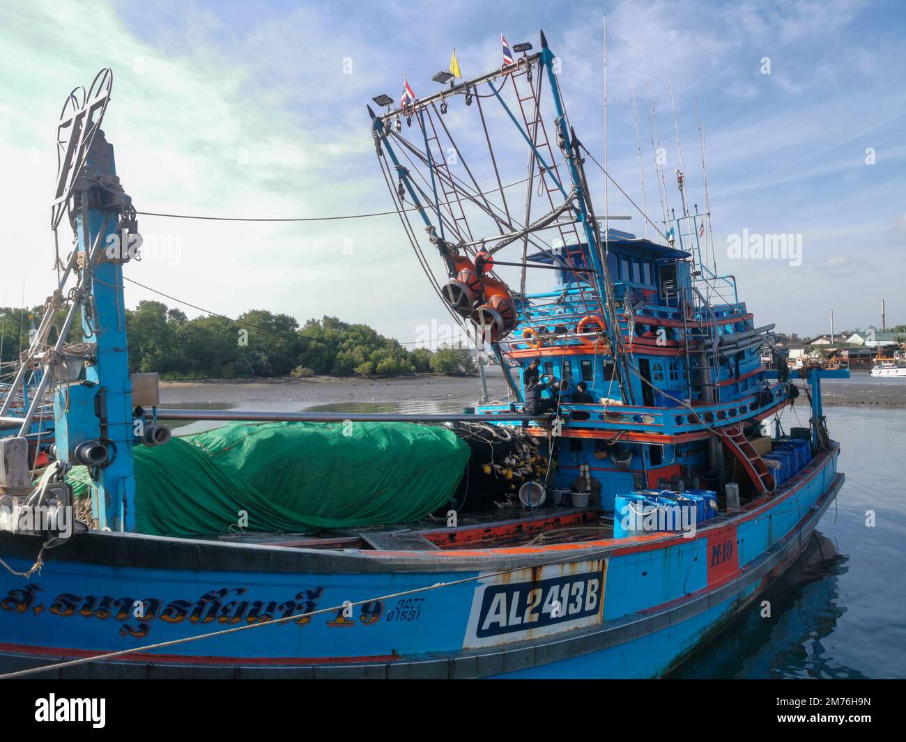 Koh Siray, Phuket, Thailand - December 29, 2022. Colorful fishing boats ...