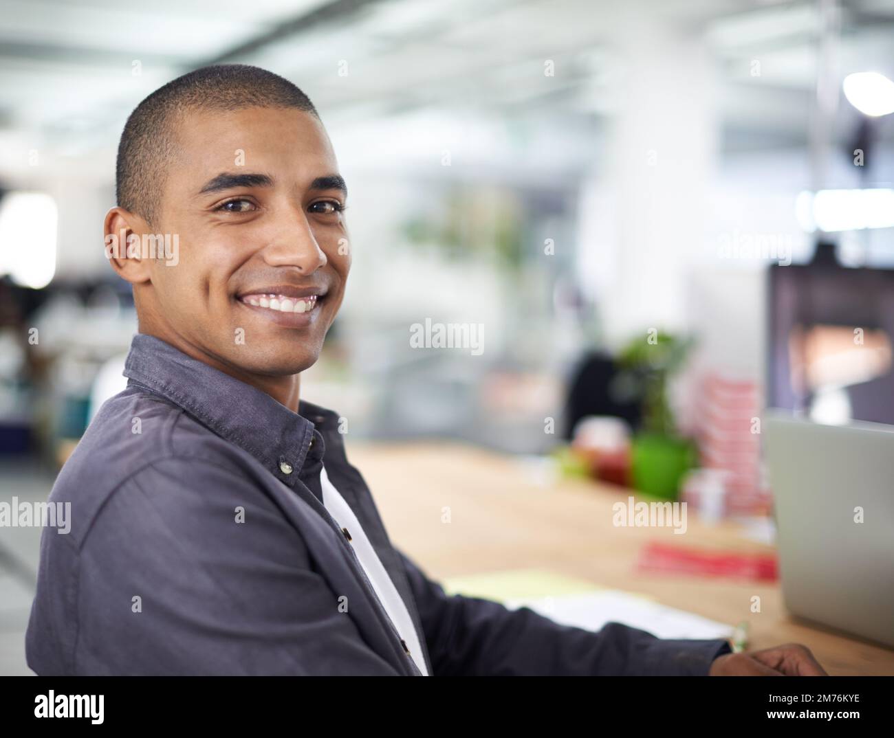 Pleased with my accomplishments so far. A smiling young designer in the ...