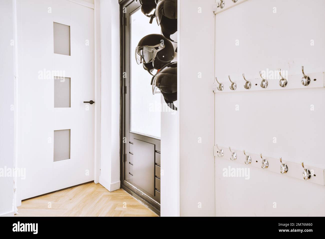 an open door with some knobs on the side and a bunch of hooks attached ...