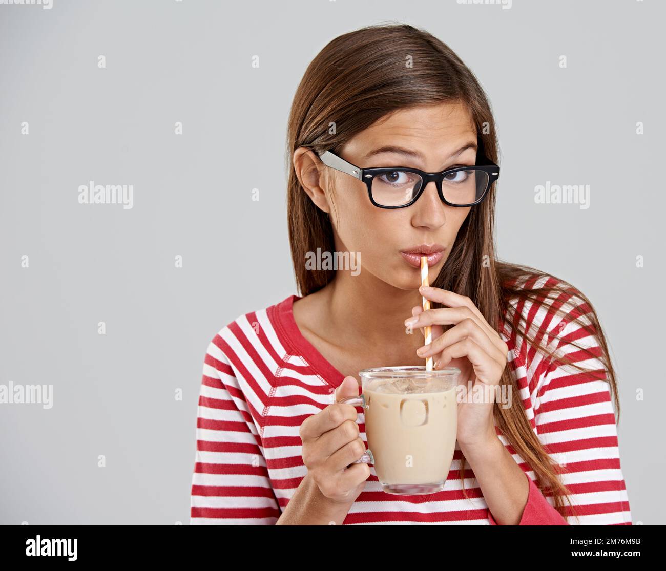 Just one milkshake couldnt hurt. Studio shot of an attractive young ...