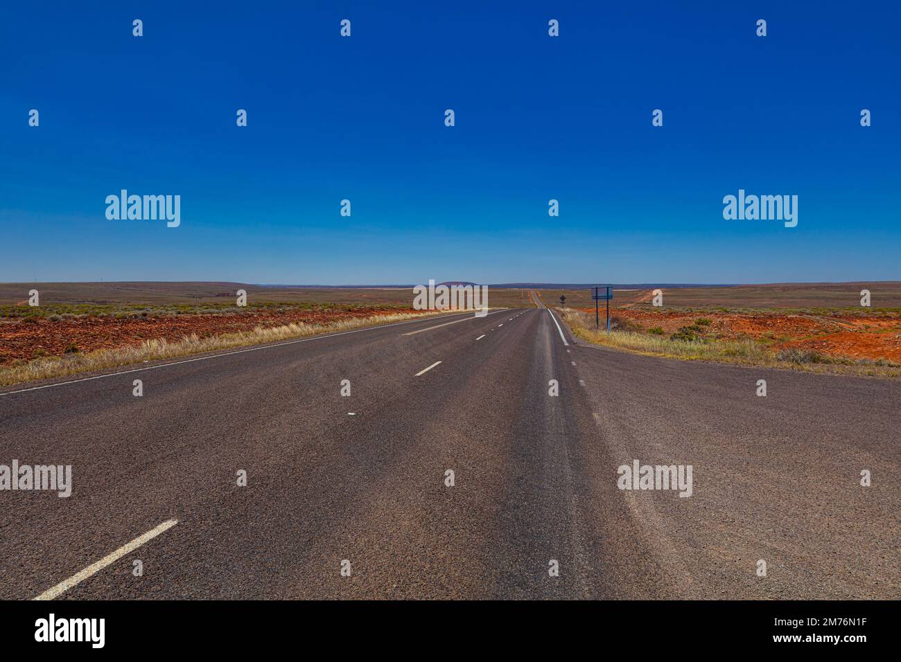 On the road side of the Stuart highway. Along the deserted barren vast ...