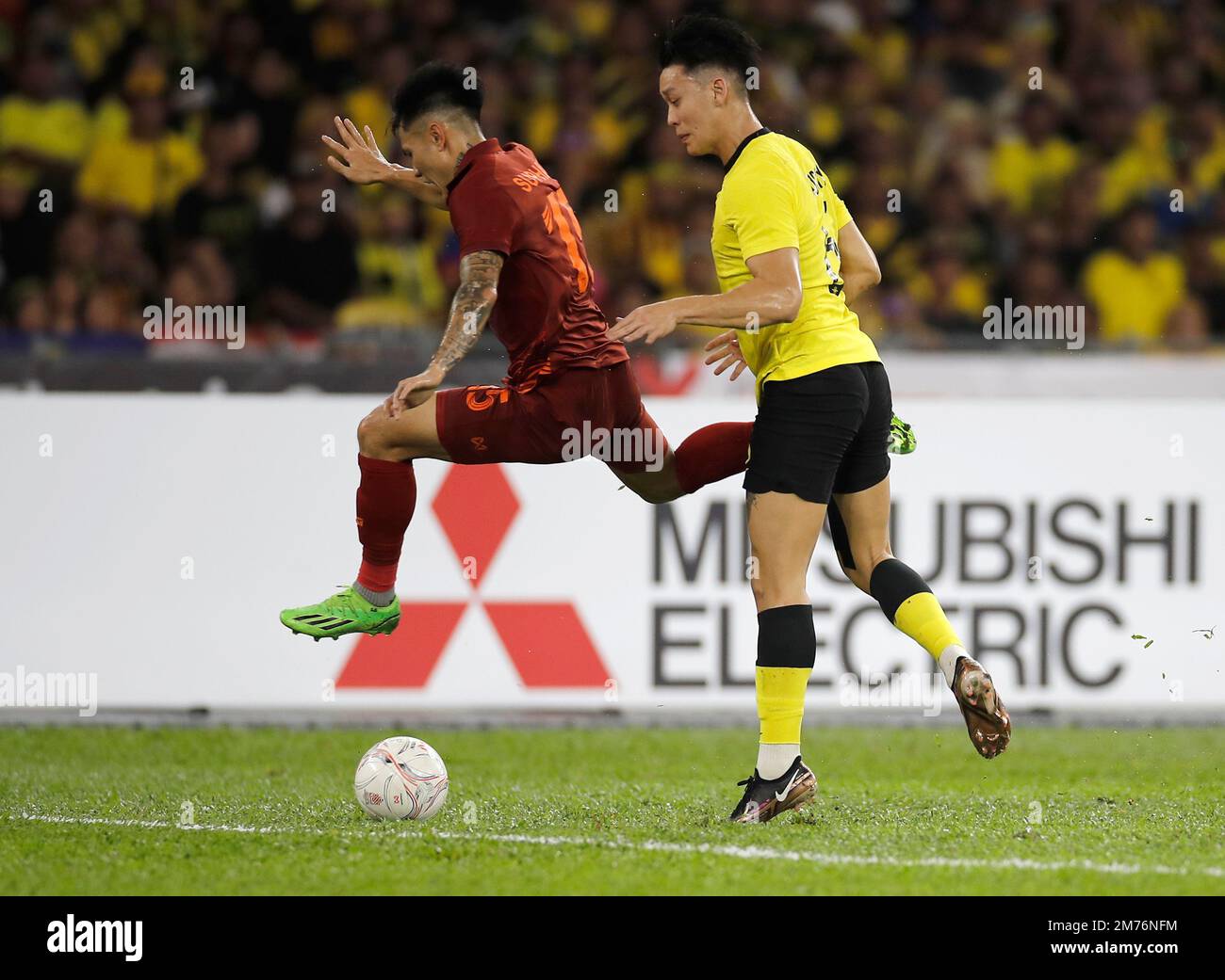 Suphanan Bureerat of Thailand (L) and Dominic Tan Jun Jin of Malaysia ...