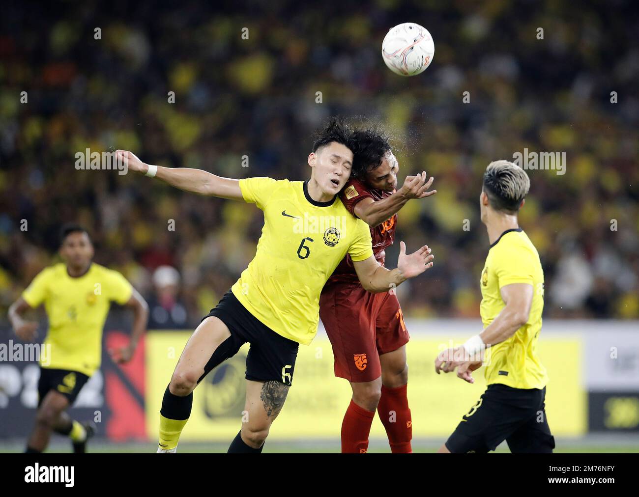 Teerasil Dangda of Thailand (C) and Dominic Tan Jun Jin (L), Brendan ...