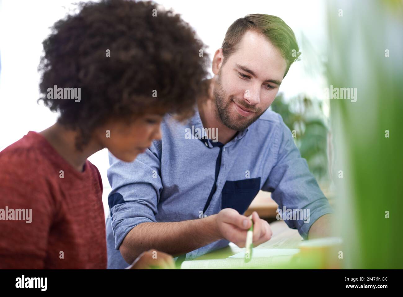 A meeting of the minds. two young design professionals working together ...