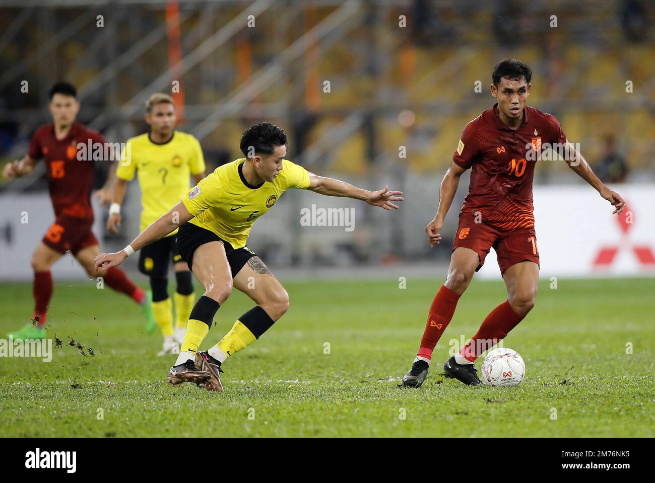 Dominic Tan Jun Jin of Malaysia (L) and Teerasil Dangda of Thailand in ...