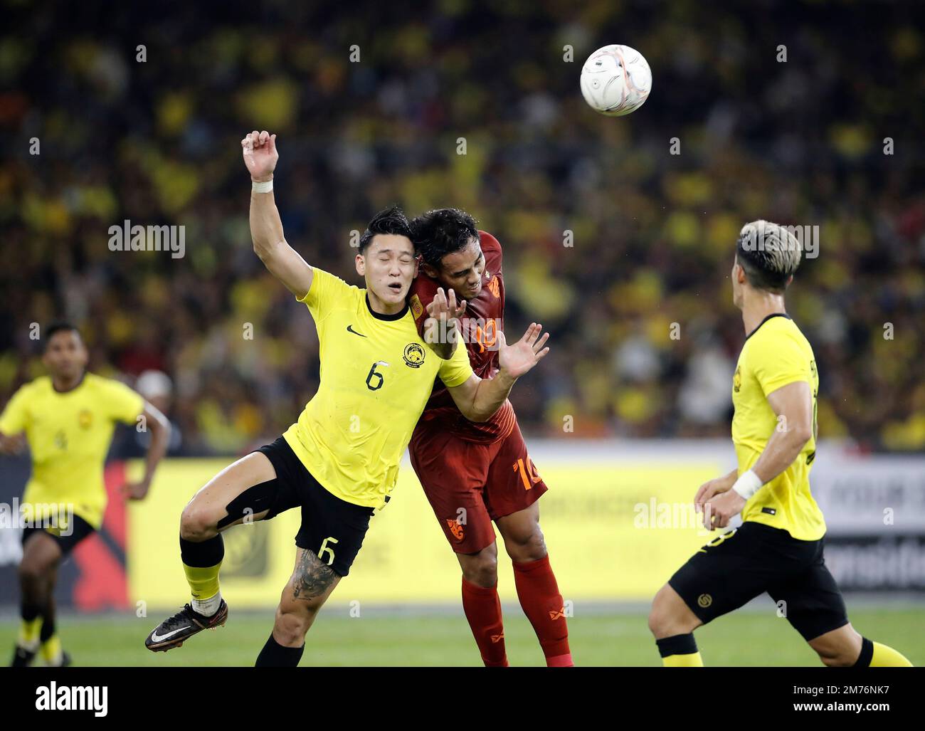 Teerasil Dangda of Thailand (C) and Dominic Tan Jun Jin (L), Brendan ...