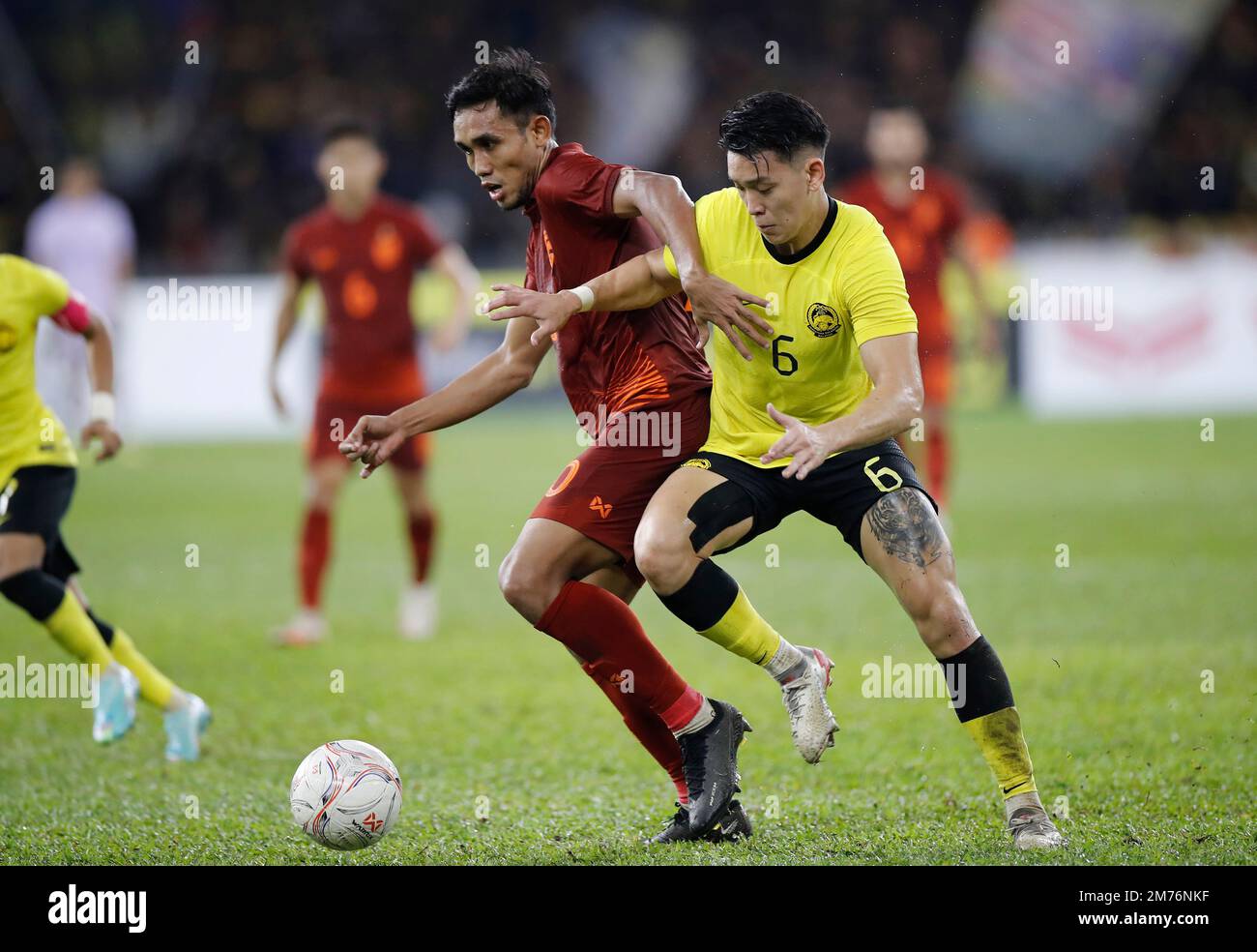 Dominic Tan Jun Jin of Malaysia (R) and Teerasil Dangda of Thailand in ...