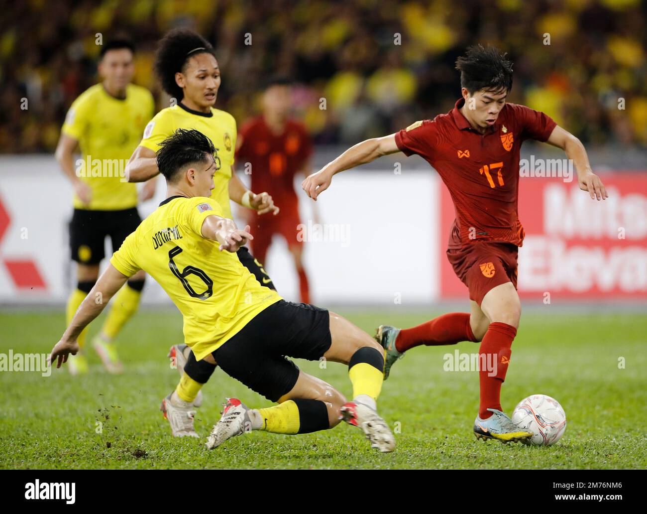 Ekanit Panya of Thailand (R) and Dominic Tan Jun Jin of Malaysia in action during the AFF ...