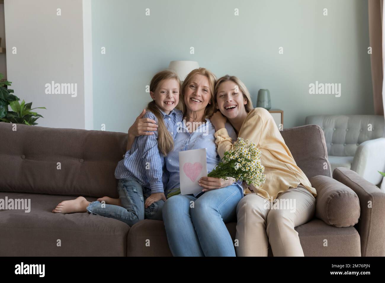 Happy beautiful kid girl, mom, grandma celebrating mothers day Stock ...