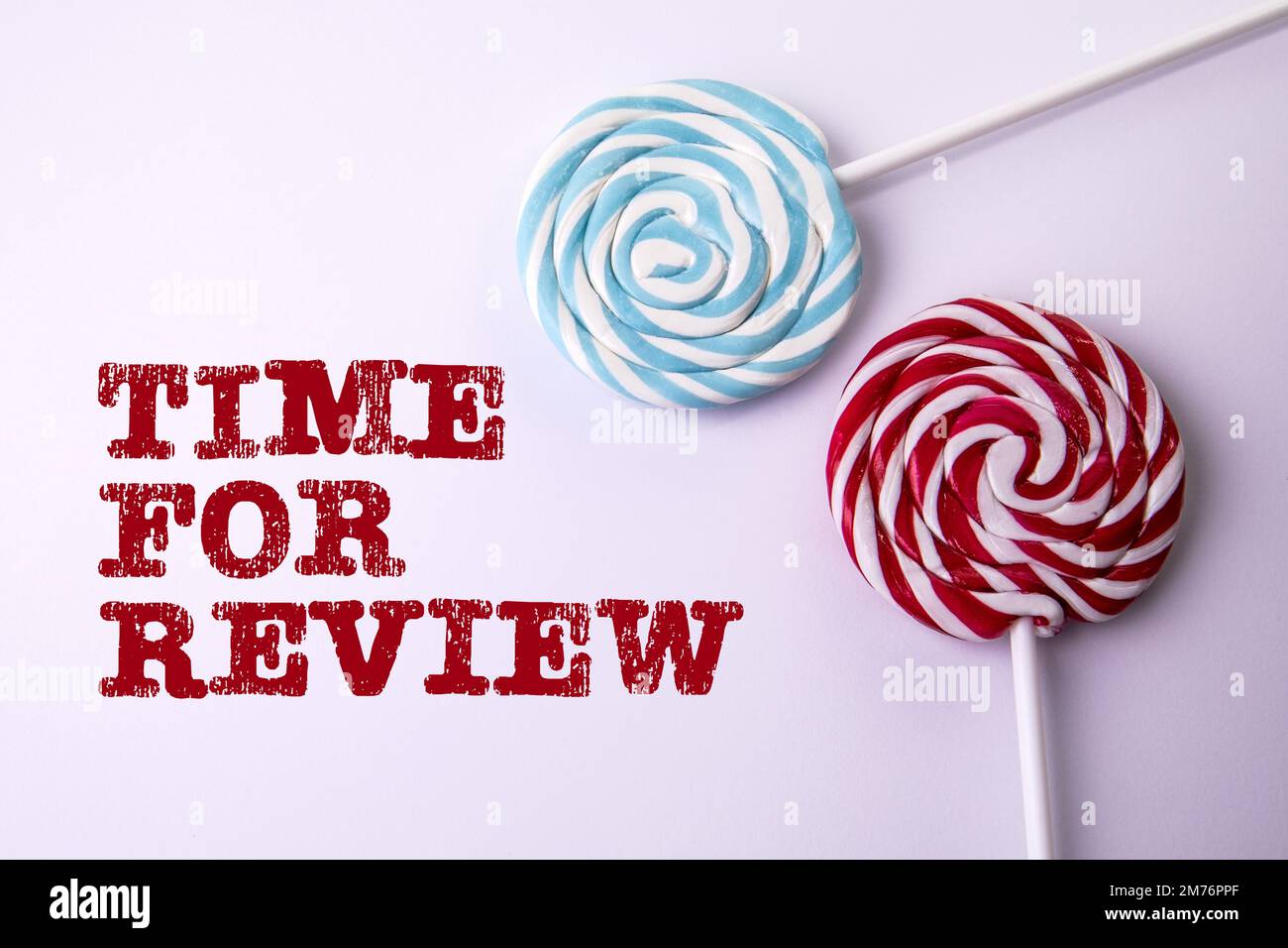 Time For Review concept. Text and lollipop on a white background Stock ...