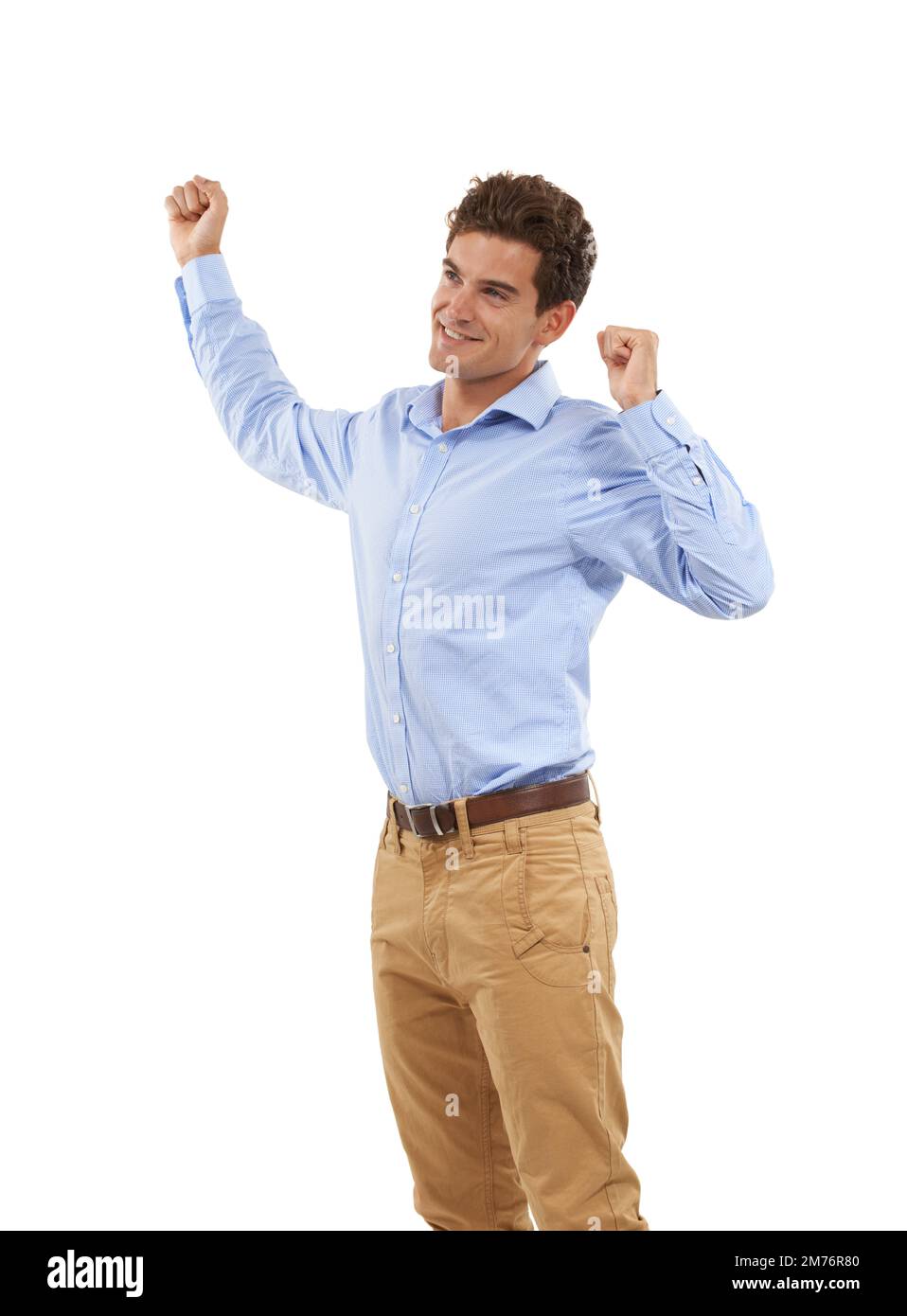 Handsome young man raising his arms in excitement Stock Photo - Alamy