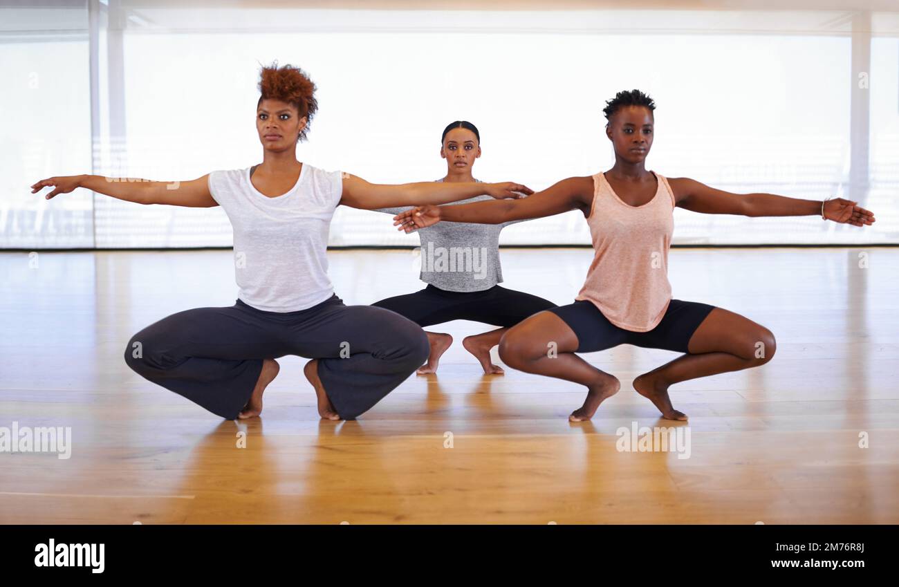 Bringing calm to the body through balance. a group of young dancers ...