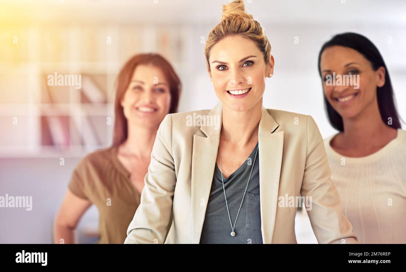 Dream designing team. Portrait of colleagues standing together in an office Stock Photo - Alamy