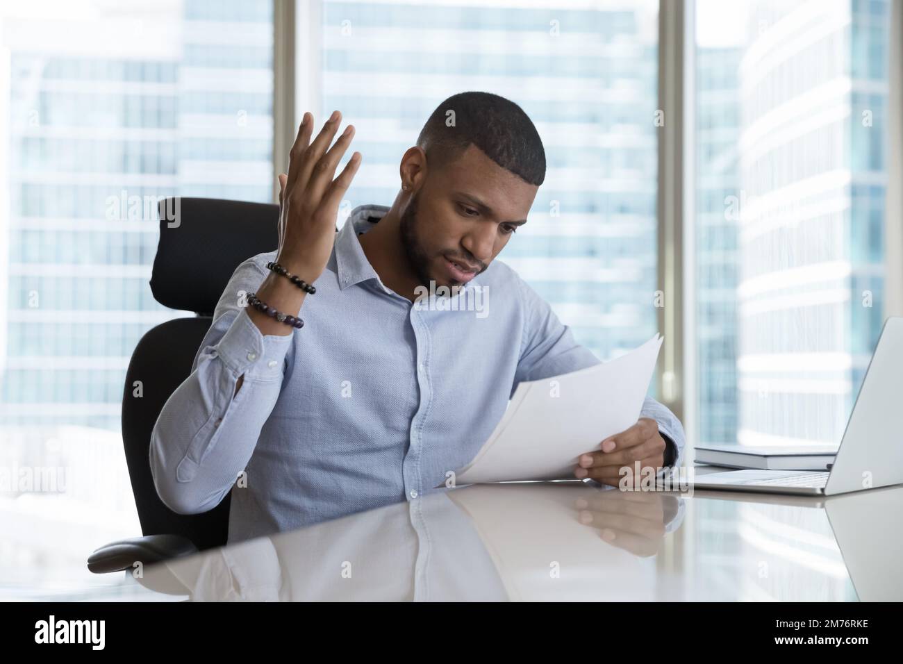 Frustrated African man read bad news in postal letter Stock Photo - Alamy